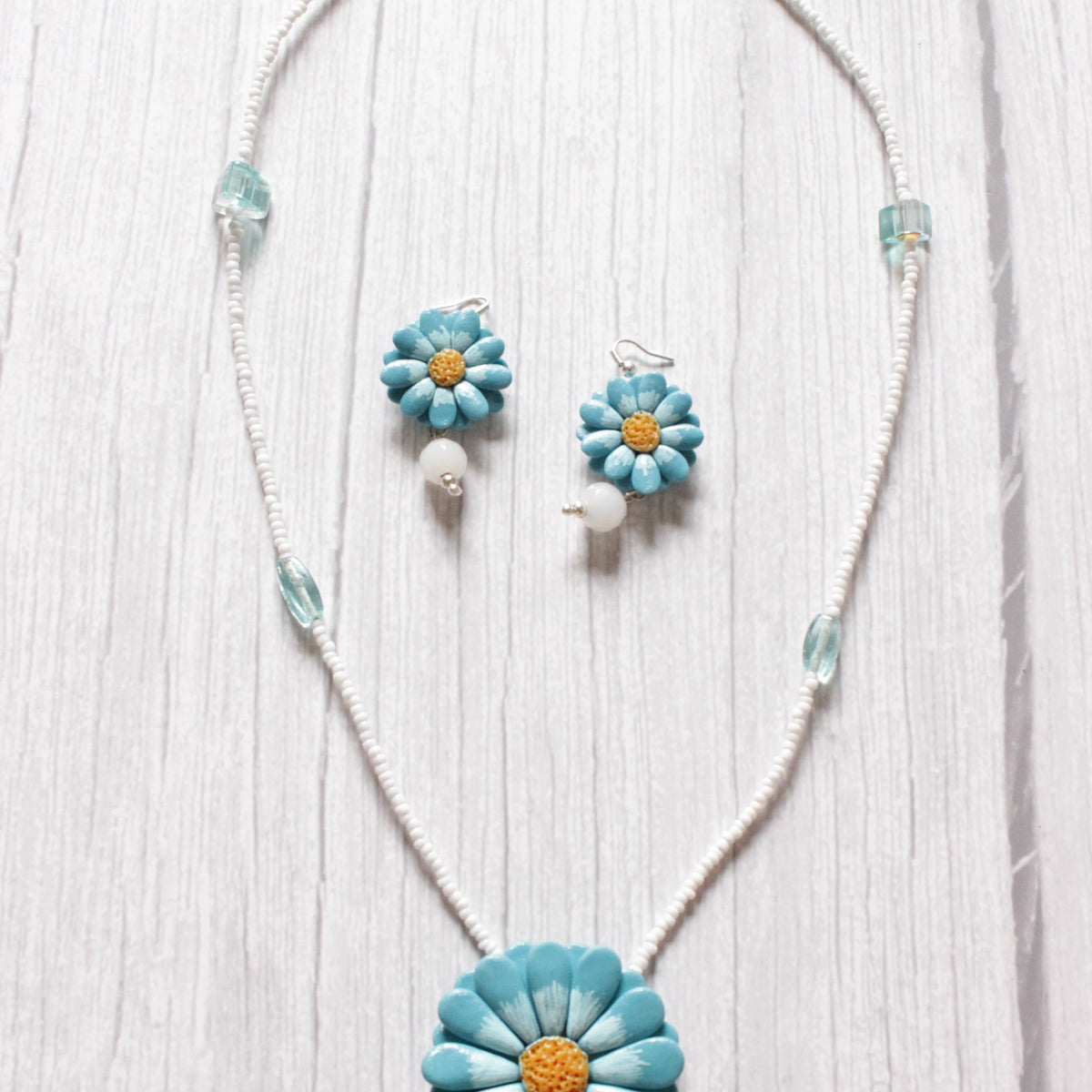 Shades of Blue Handcrafted Clay Flower Jewelry with White Beaded Strin ...